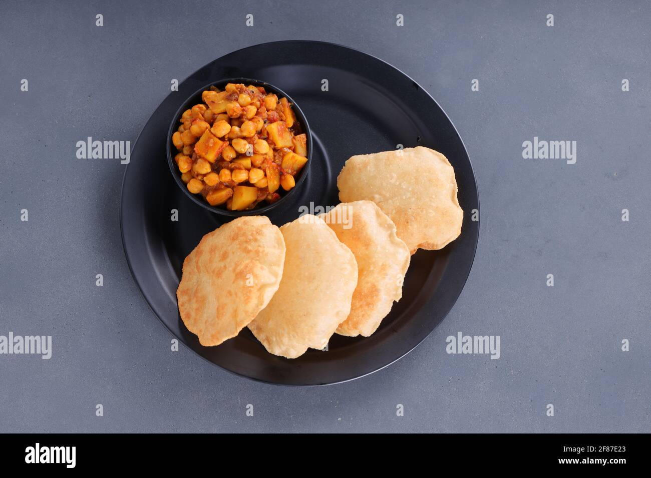 Indian breakfast Puri with chickpea chana masala curry,tasty indian ...