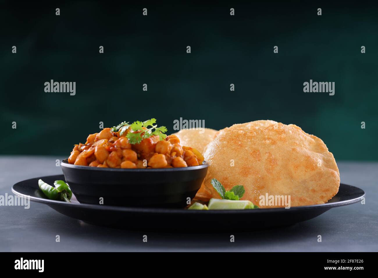 Indian breakfast Poori with chickpea chana masala curry,tasty indian ...