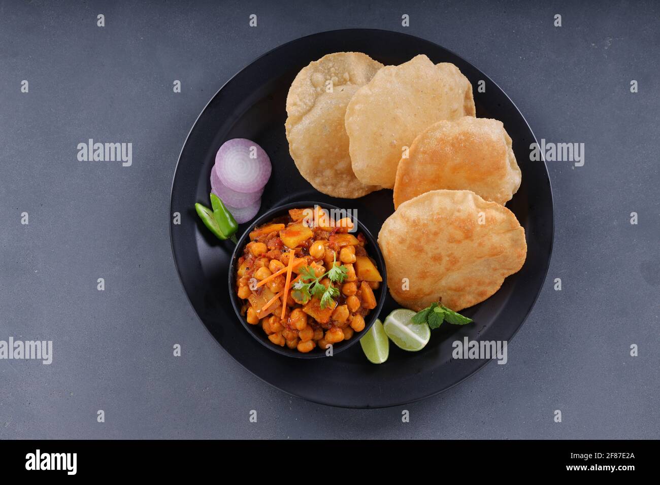 Indian breakfast Puri with chickpea chana masala curry,tasty indian ...