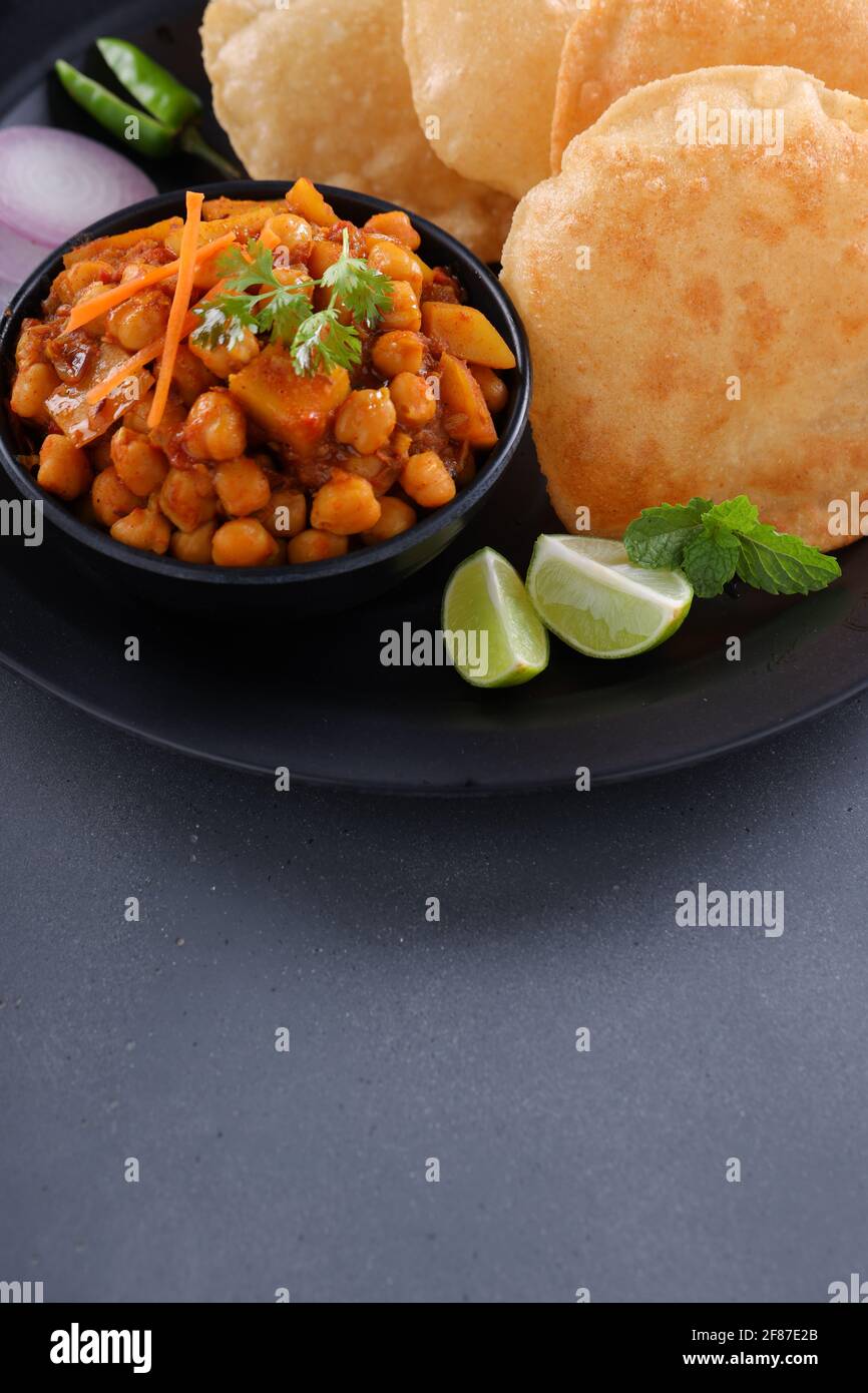 Indian breakfast Poori with chickpea chana masala curry,tasty indian ...