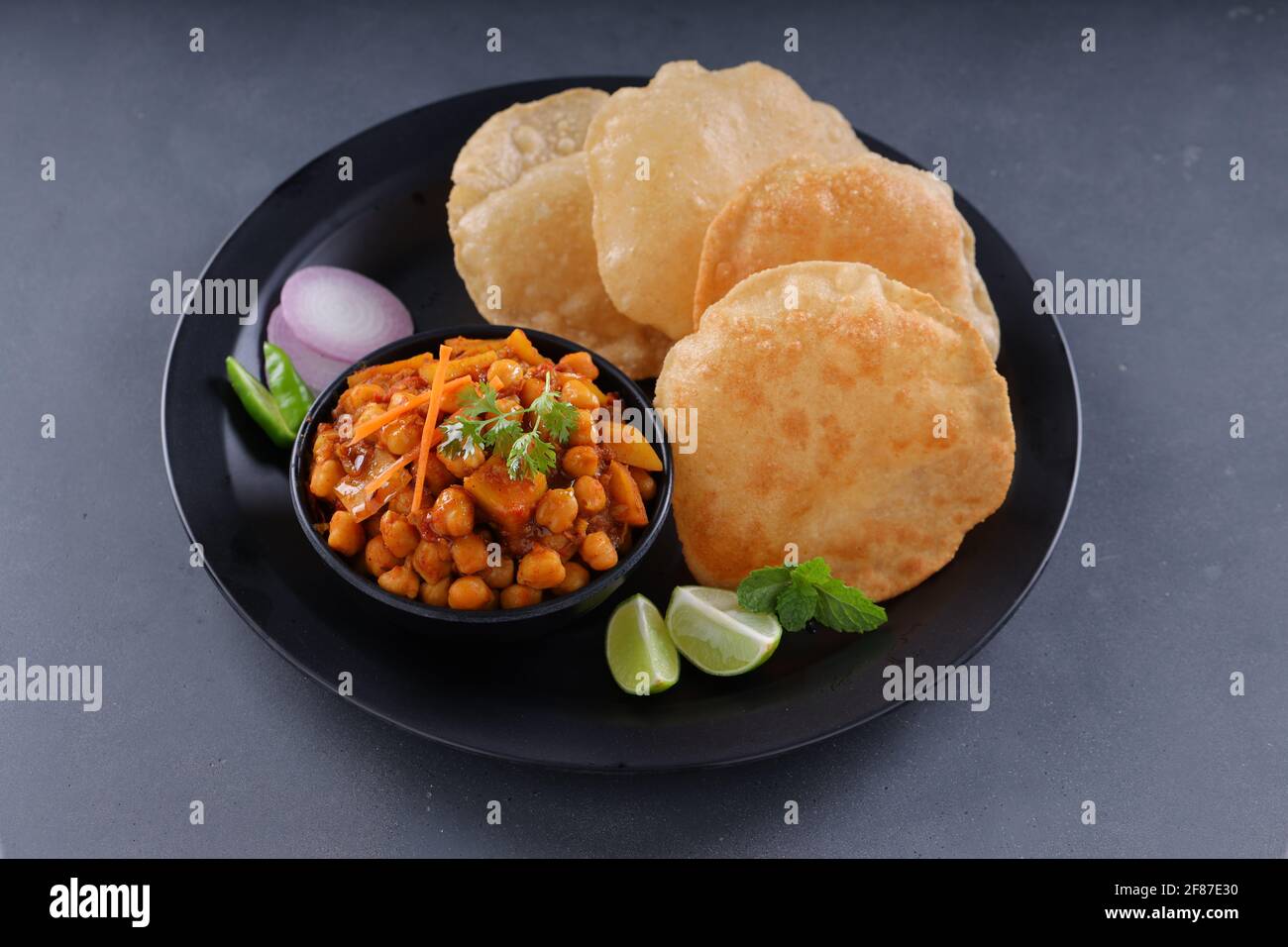 Indian breakfast Poori with chickpea chana masala curry,tasty indian ...