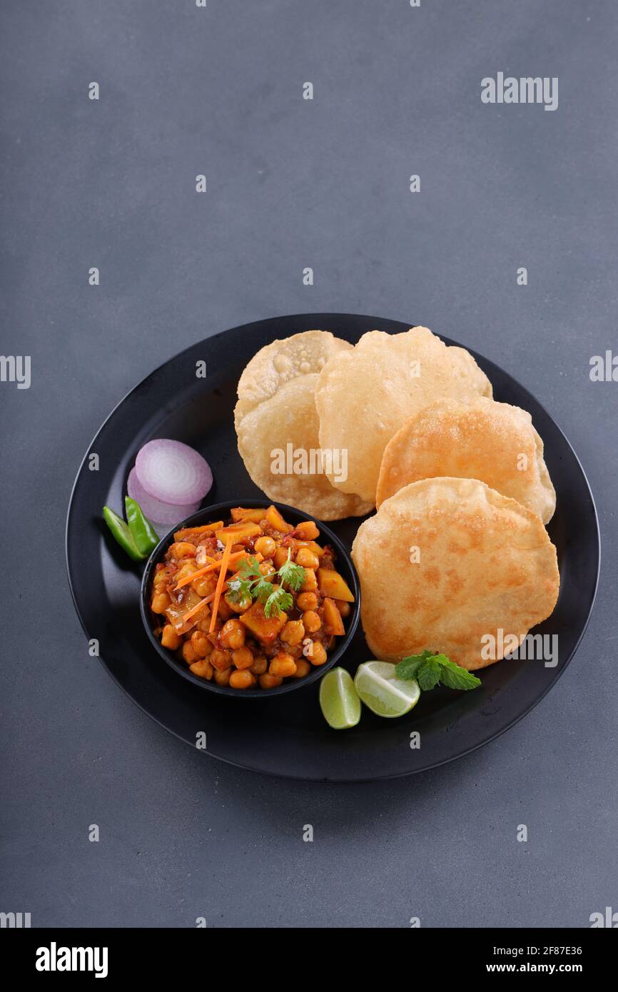 Indian breakfast Puri with chickpea chana masala curry,tasty indian ...