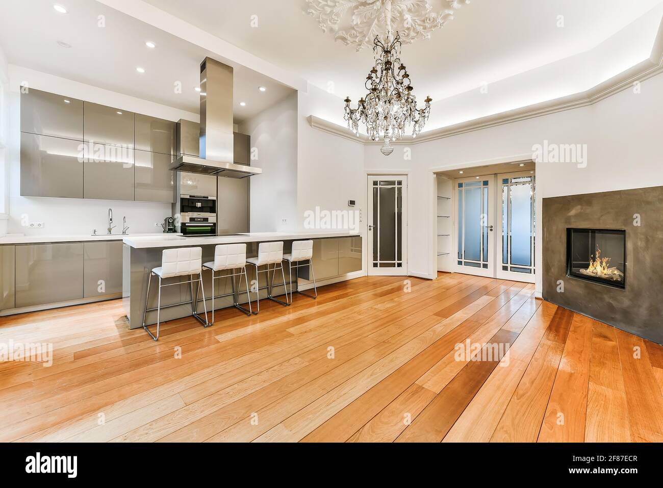 Empty dining room near kitchen Stock Photo - Alamy
