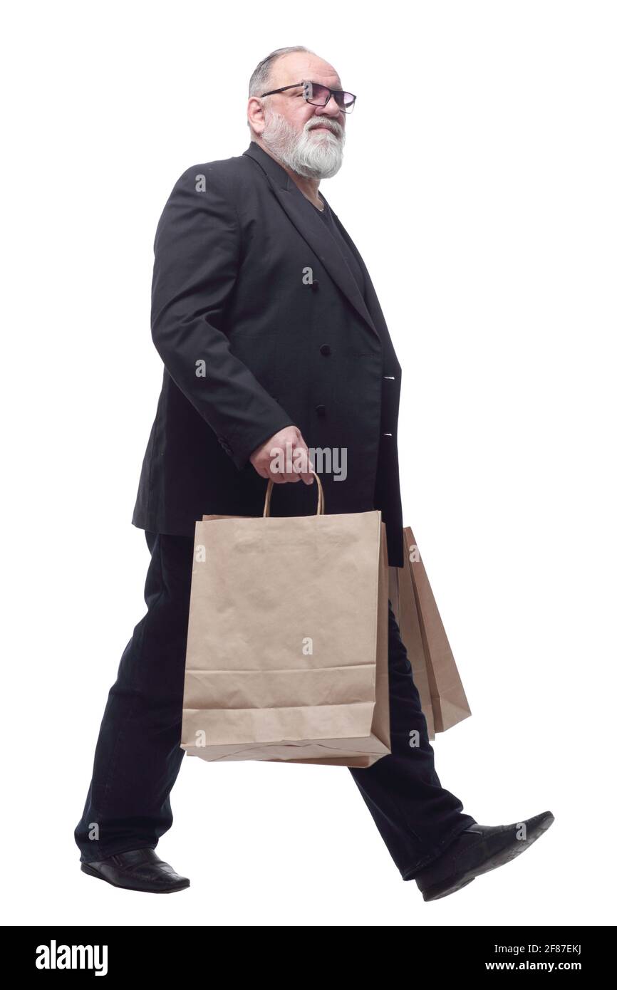 confident business man with shopping bags striding forward Stock Photo ...