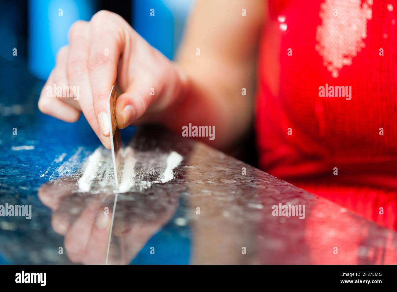 Young woman snorting cocaine with her credit card, close-up Stock Photo ...
