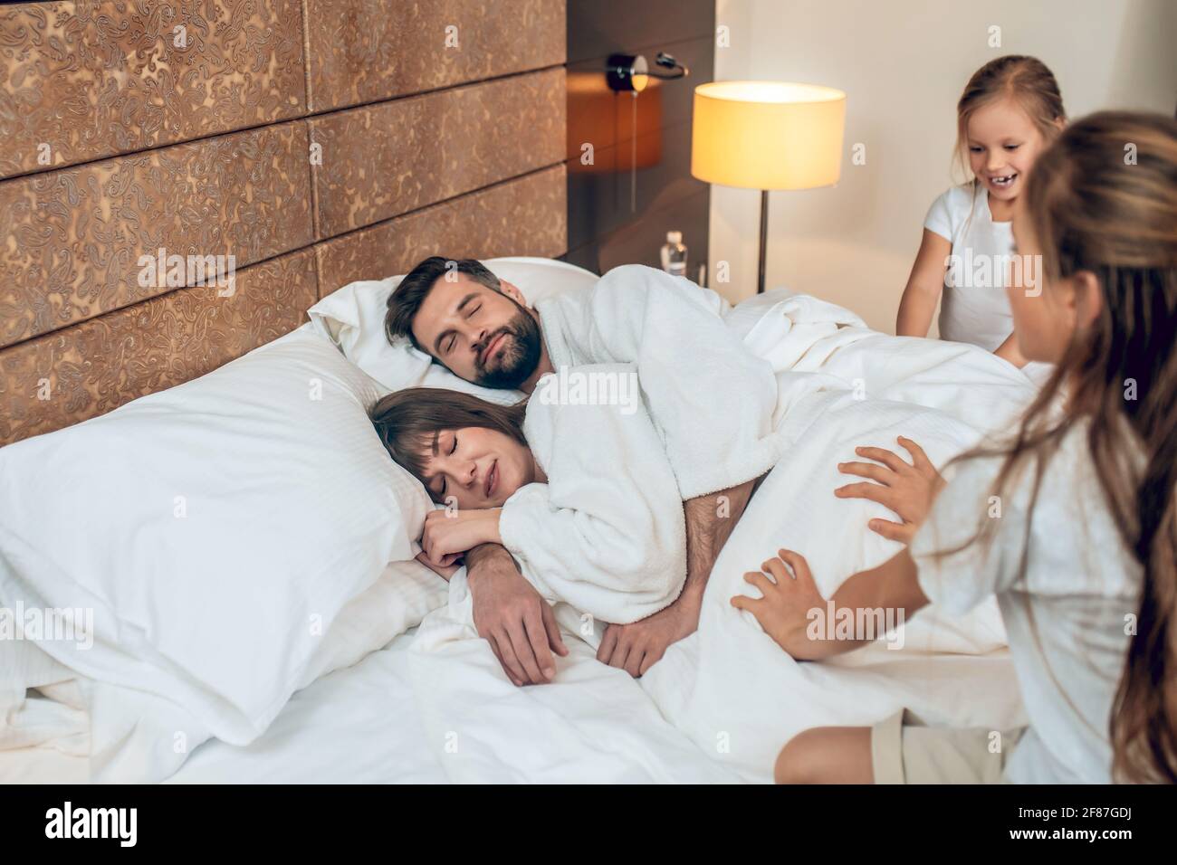 Kids waking up parents hi-res stock photography and images - Alamy