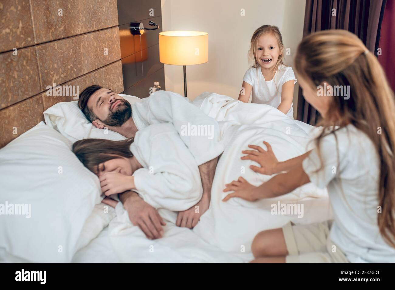 Kids waking up parents hi-res stock photography and images - Alamy