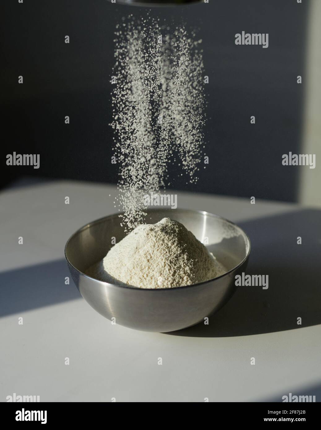 Sifting flour through metal sifter hi-res stock photography and images ...