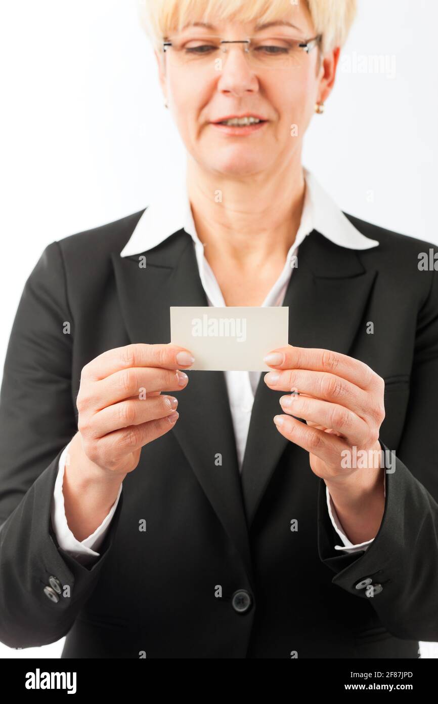 Mature woman showing her business card, closed-up Stock Photo - Alamy