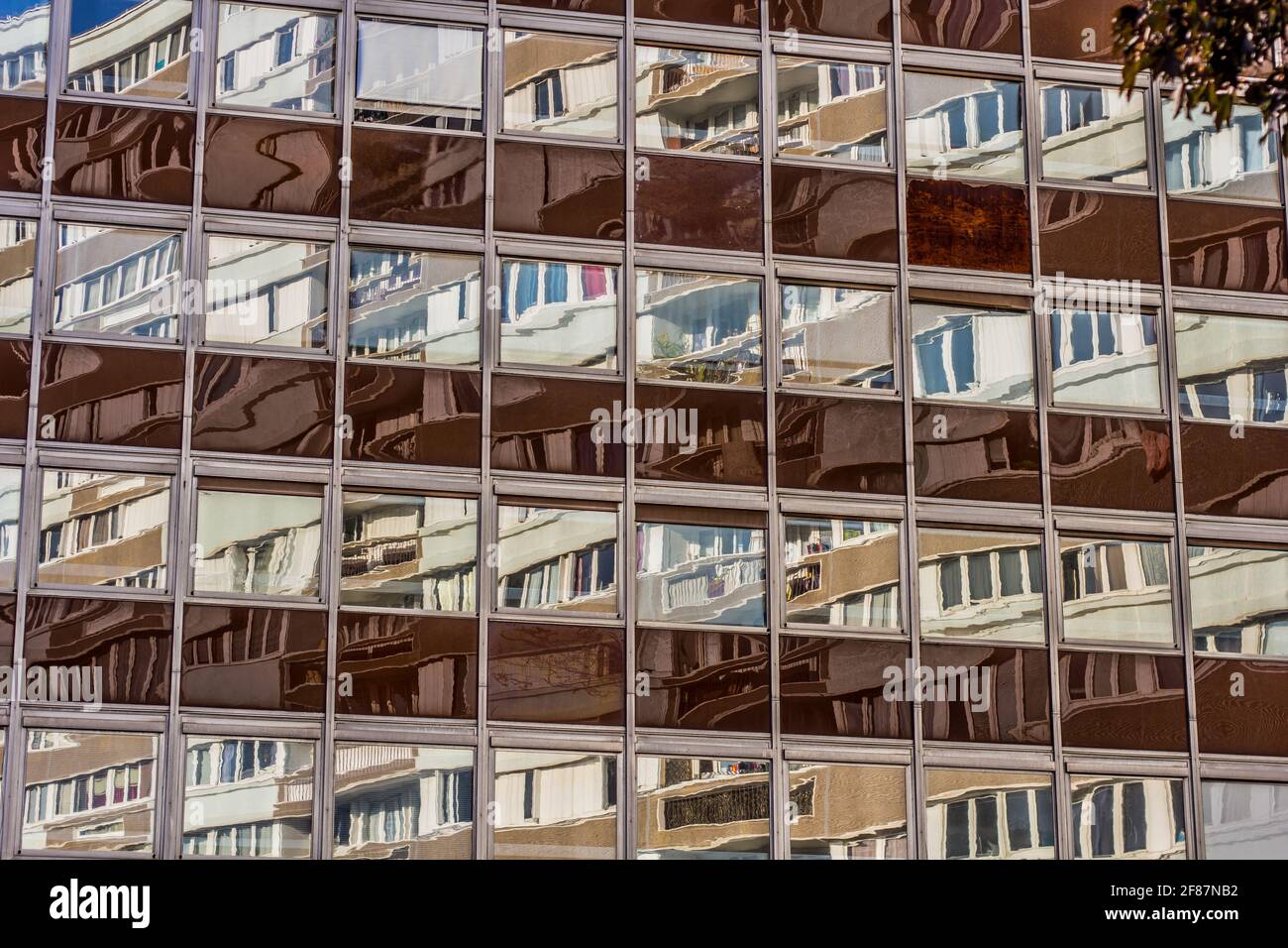 Reflection in a glass facade of a building Stock Photo - Alamy