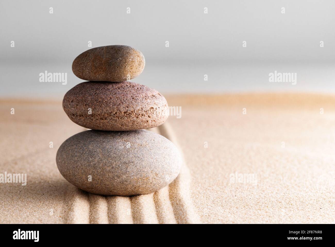 Japanese zen garden with stone in raked sand Stock Photo - Alamy
