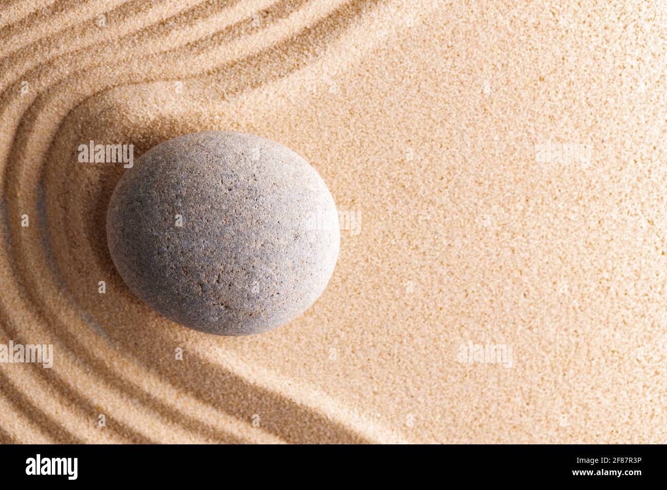 Japanese zen garden with stone in raked sand Stock Photo - Alamy