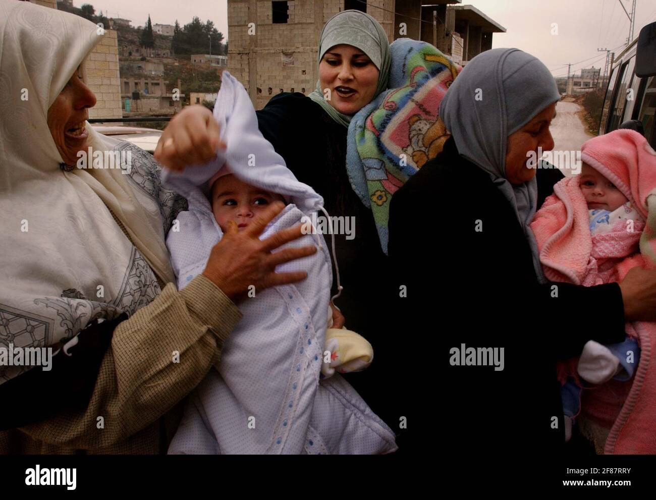 A PROUD PALESTINIAN MOTHER WITH HER NEWLY BORN TRIPLETS BORN IN THE ...