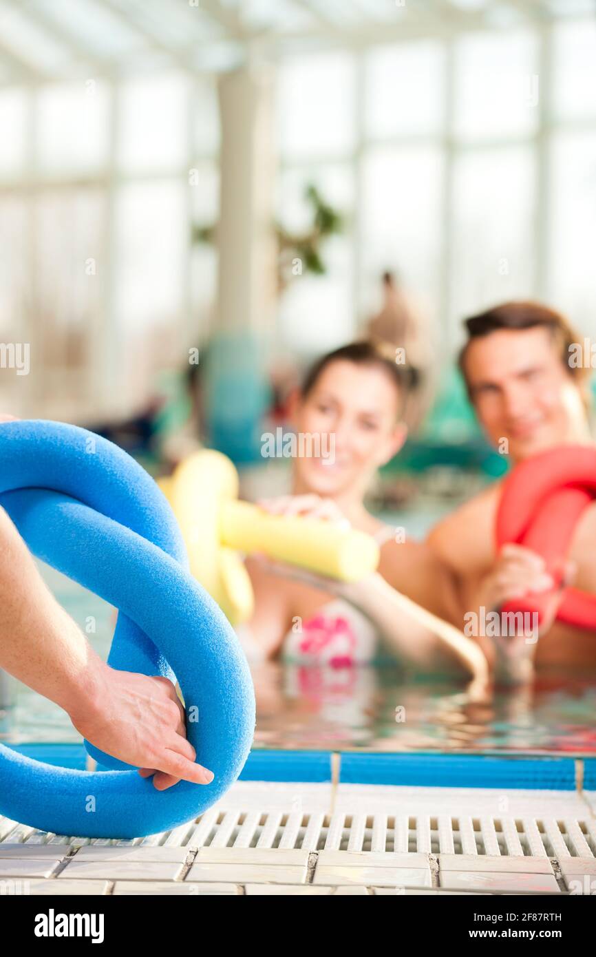 Fitness - a young couple - man and woman - doing sports and gymnastics ...