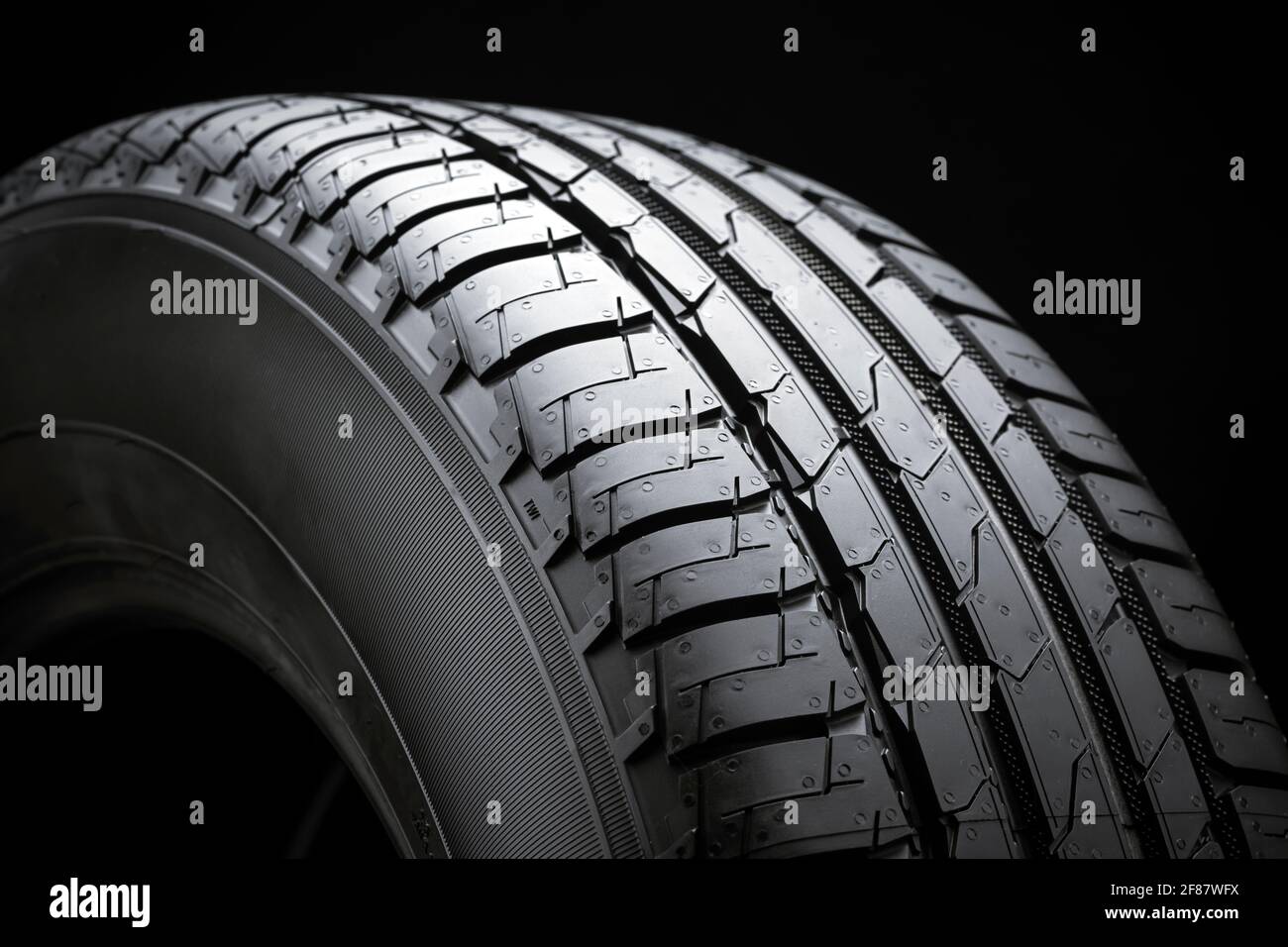 summer car tire tread, side view, black background Stock Photo - Alamy