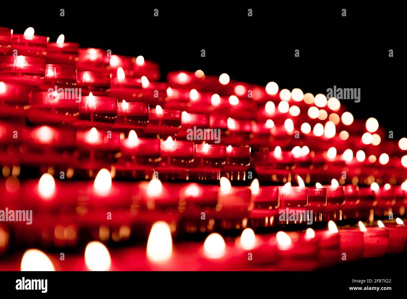 Group of red candles in church for faith resurrection prayer ...