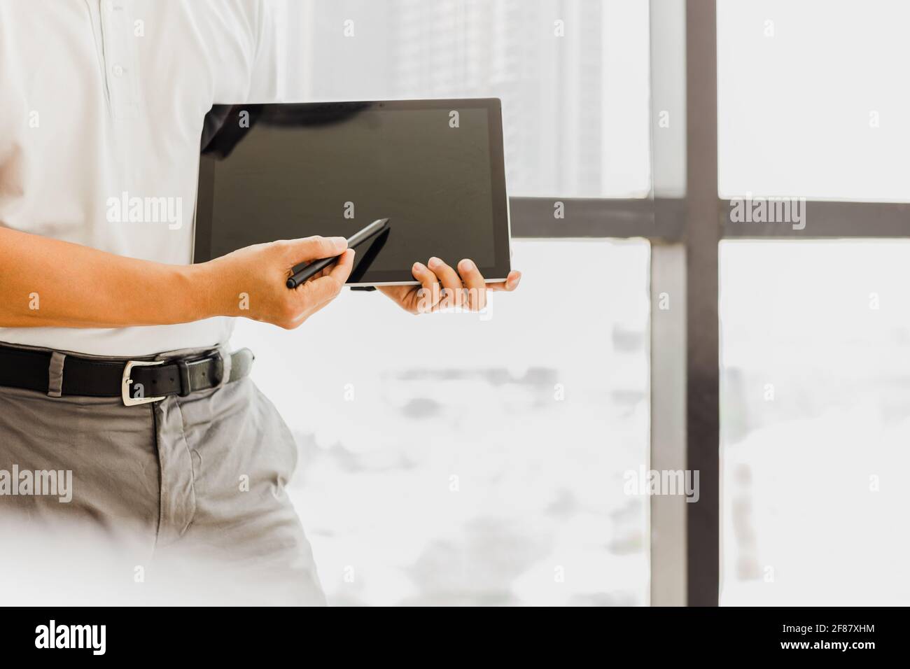 Asian business man presenting digital tablet with blank screen Stock ...