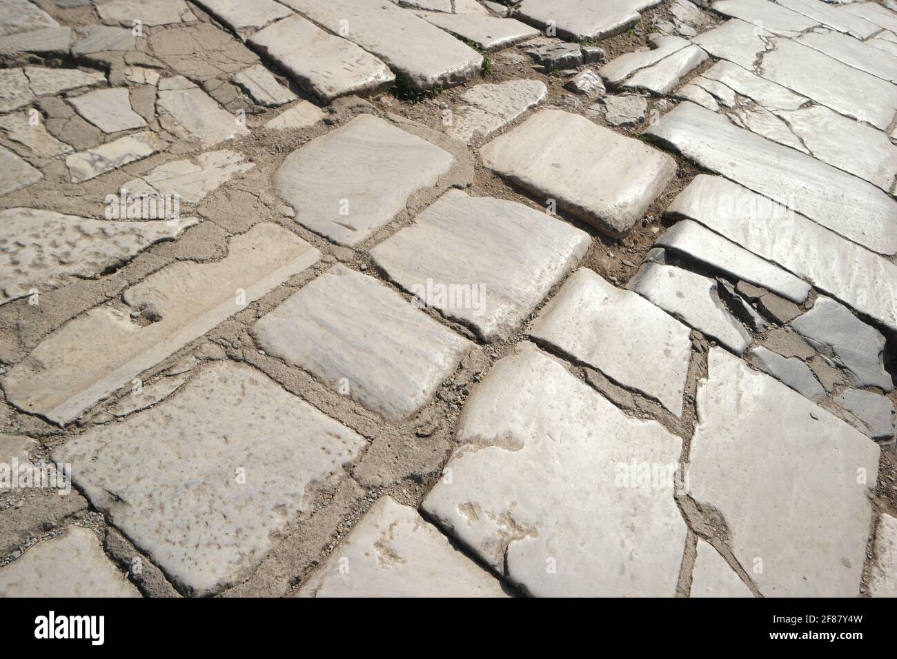 Block pavement of an ancient street. Stone road background Stock Photo ...