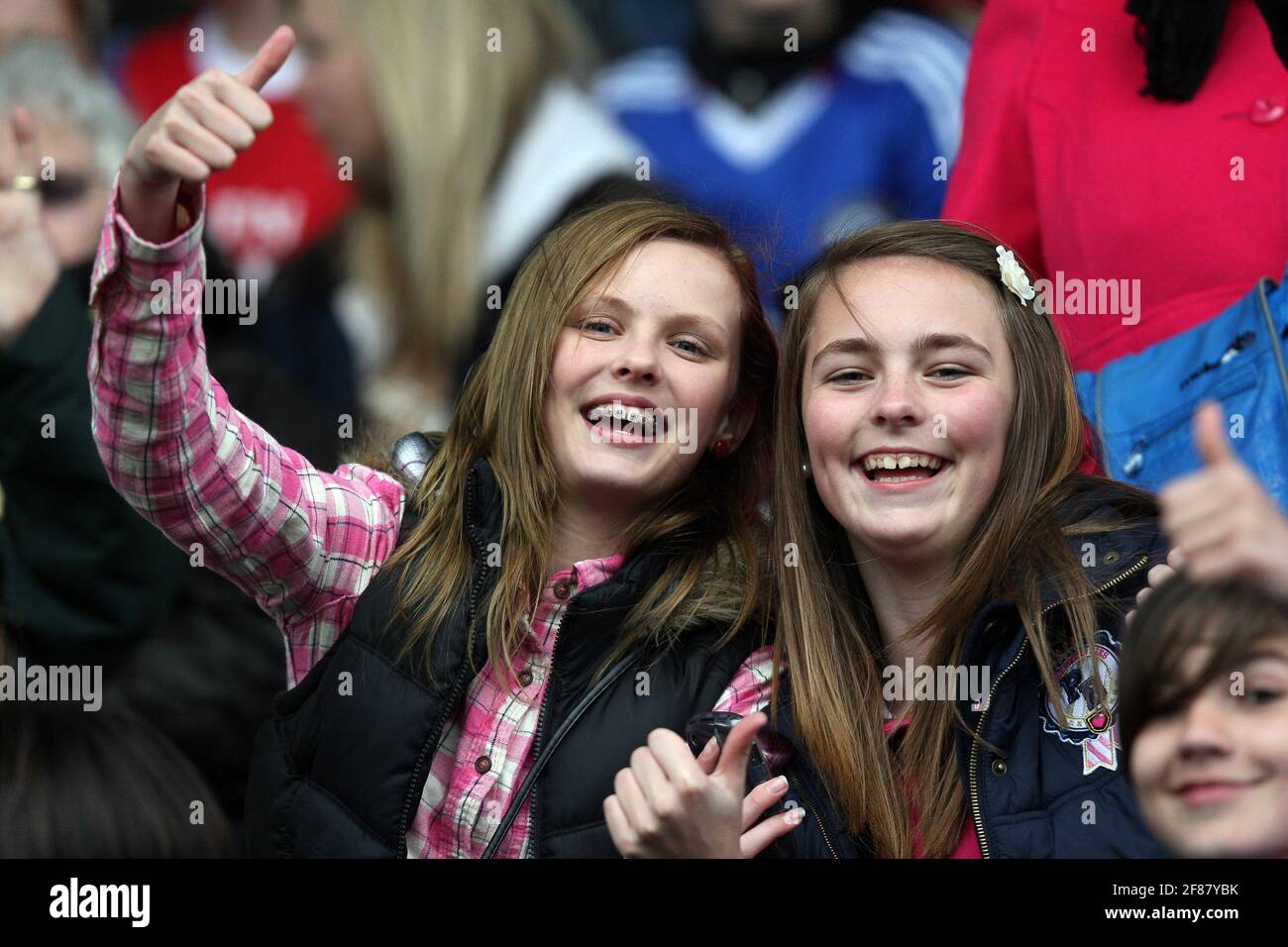 Young fans enjoy the game Stock Photo - Alamy