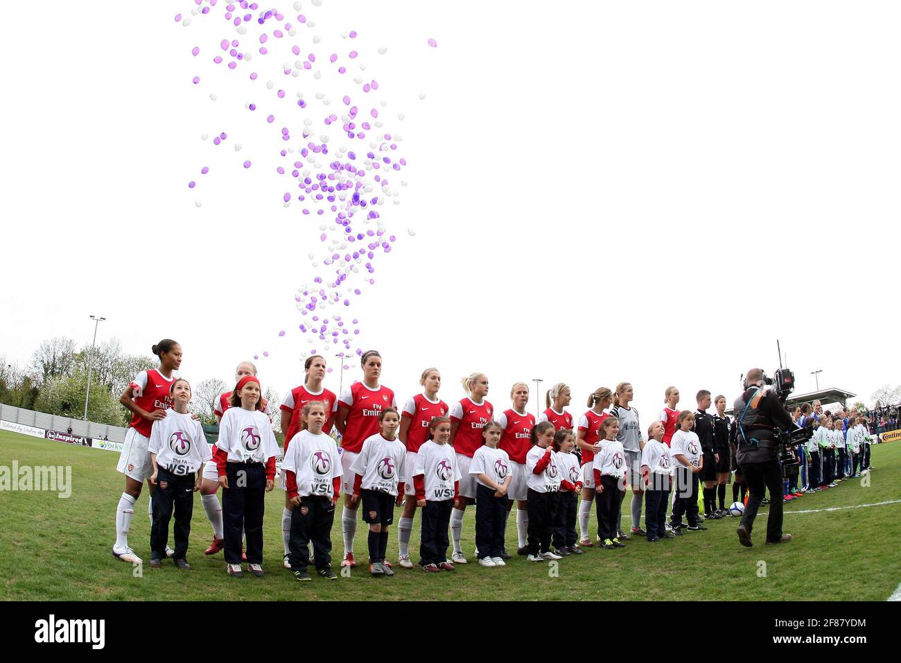 Balloons are launched as the teams line up before kick-off Stock Photo ...