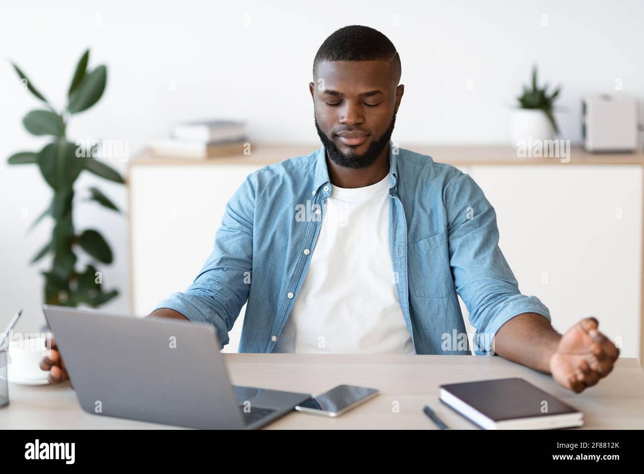 Coping With Working Stress. Portraif Of Calm Black Man Meditating At ...