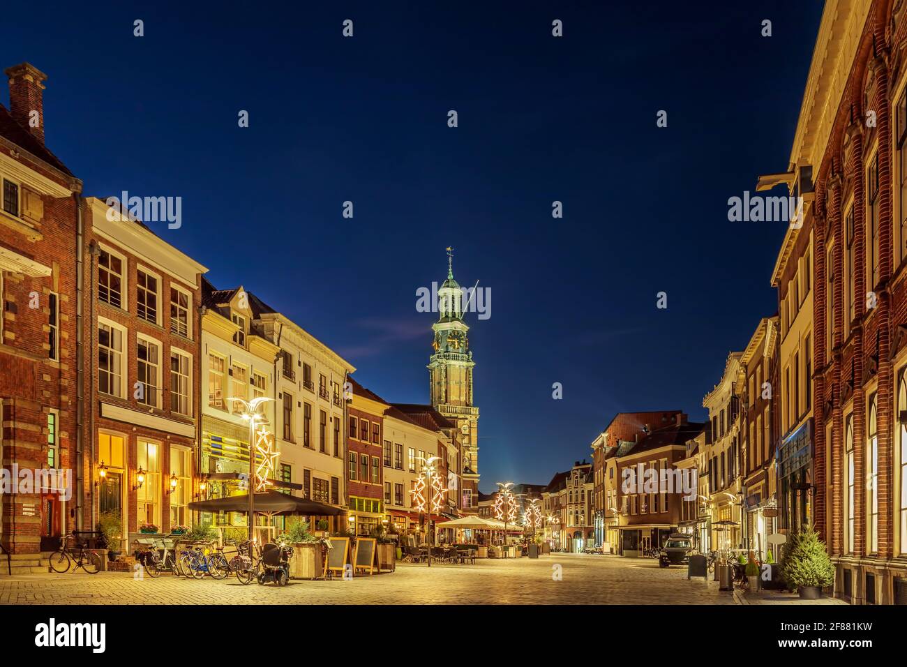 Bars and restaurants with christmas lights on the Houtmarkt square in ...