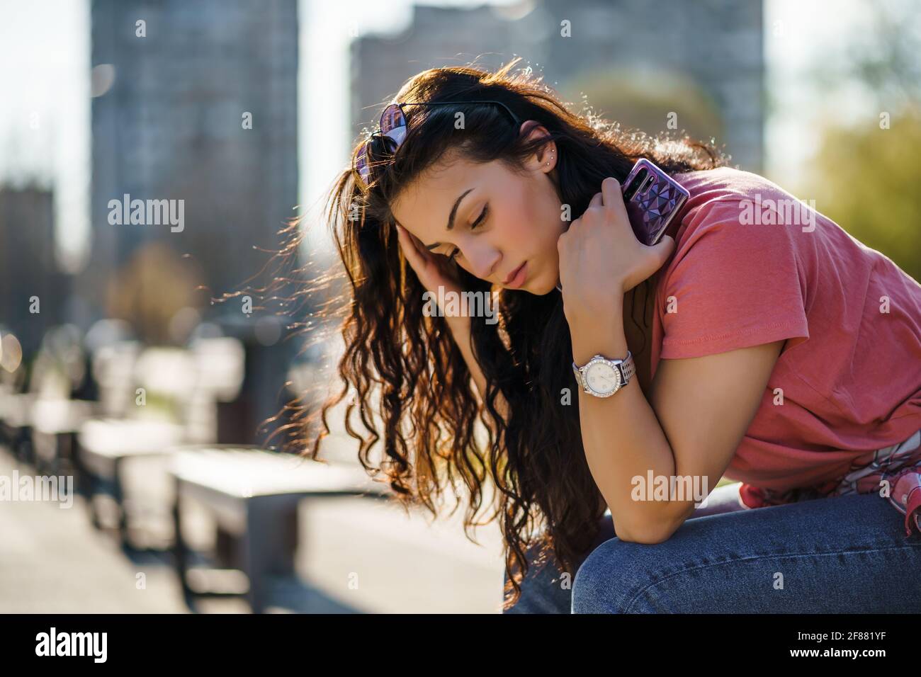 Depressed woman sitting on bench hi-res stock photography and images ...