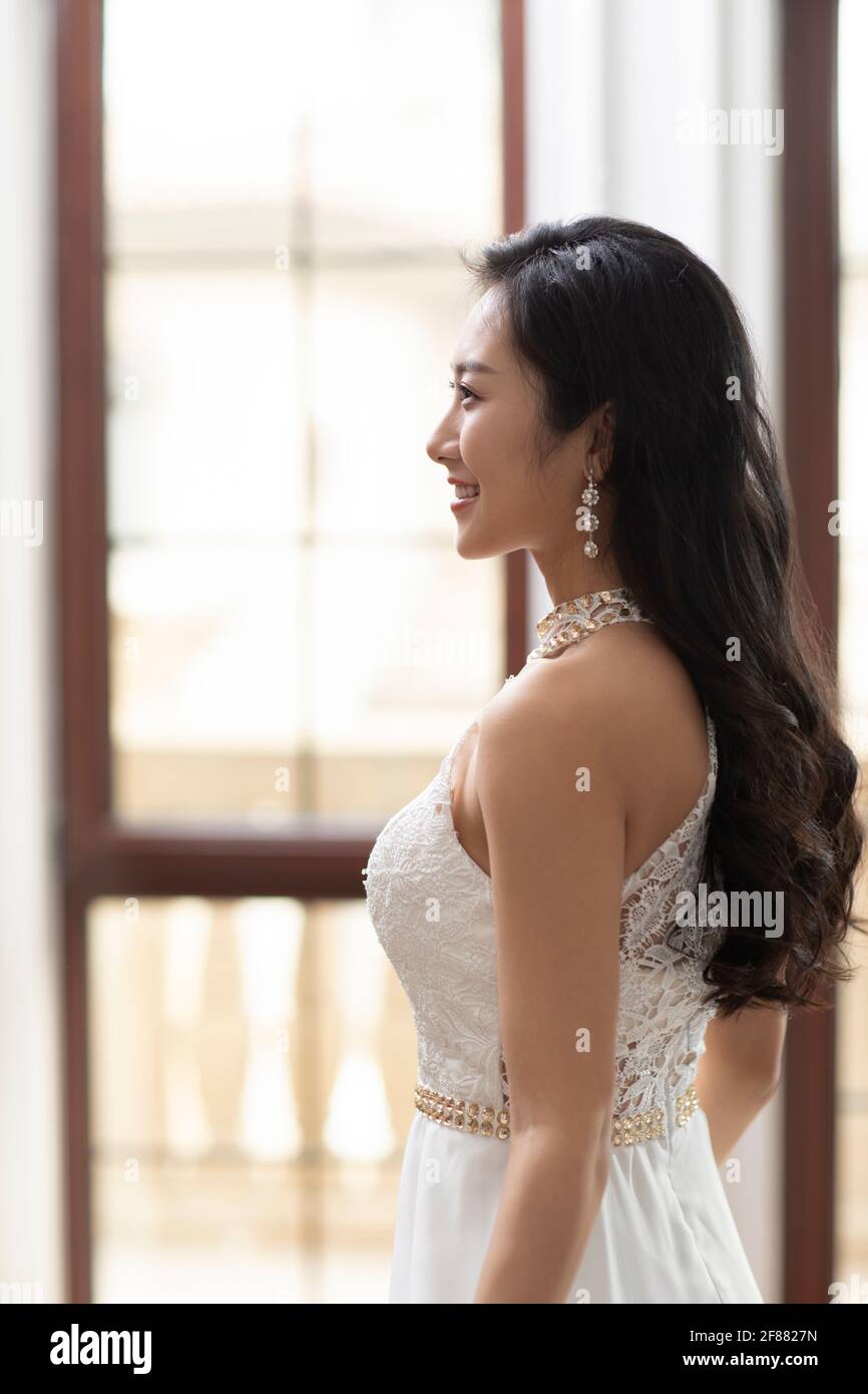 Woman getting dressed hi-res stock photography and images - Alamy