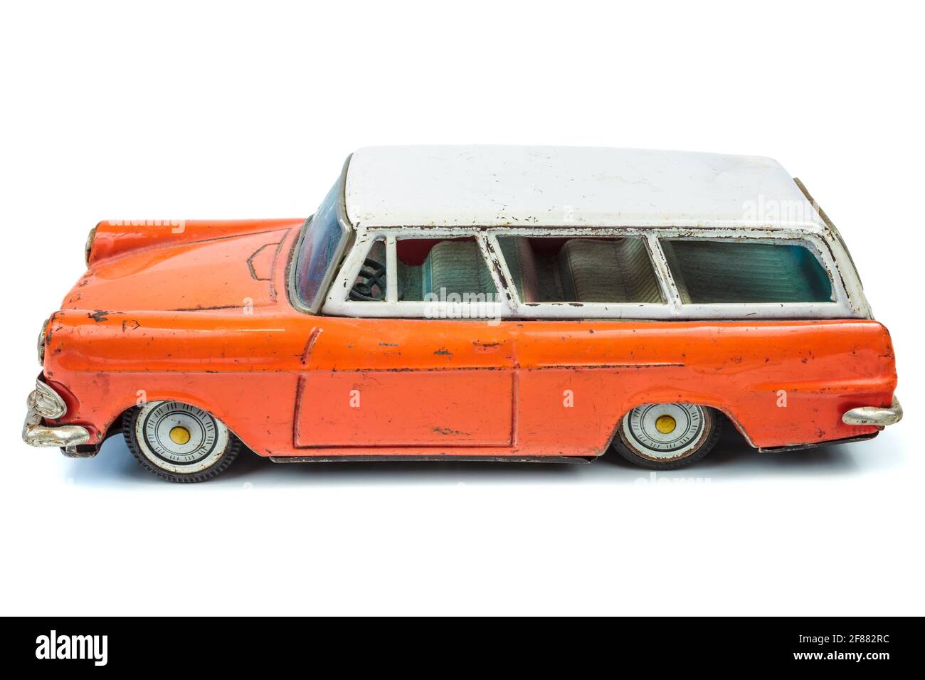 Classic miniature orange and white family combi car isolated on a white ...
