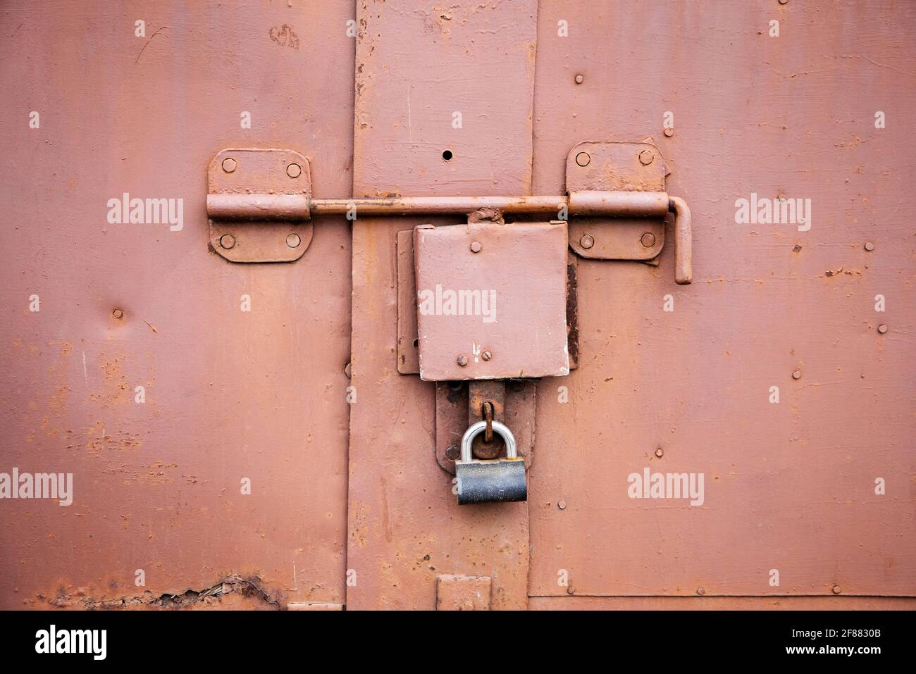 Old lock of the metal door. Rusty old metal texture with remnants of ...