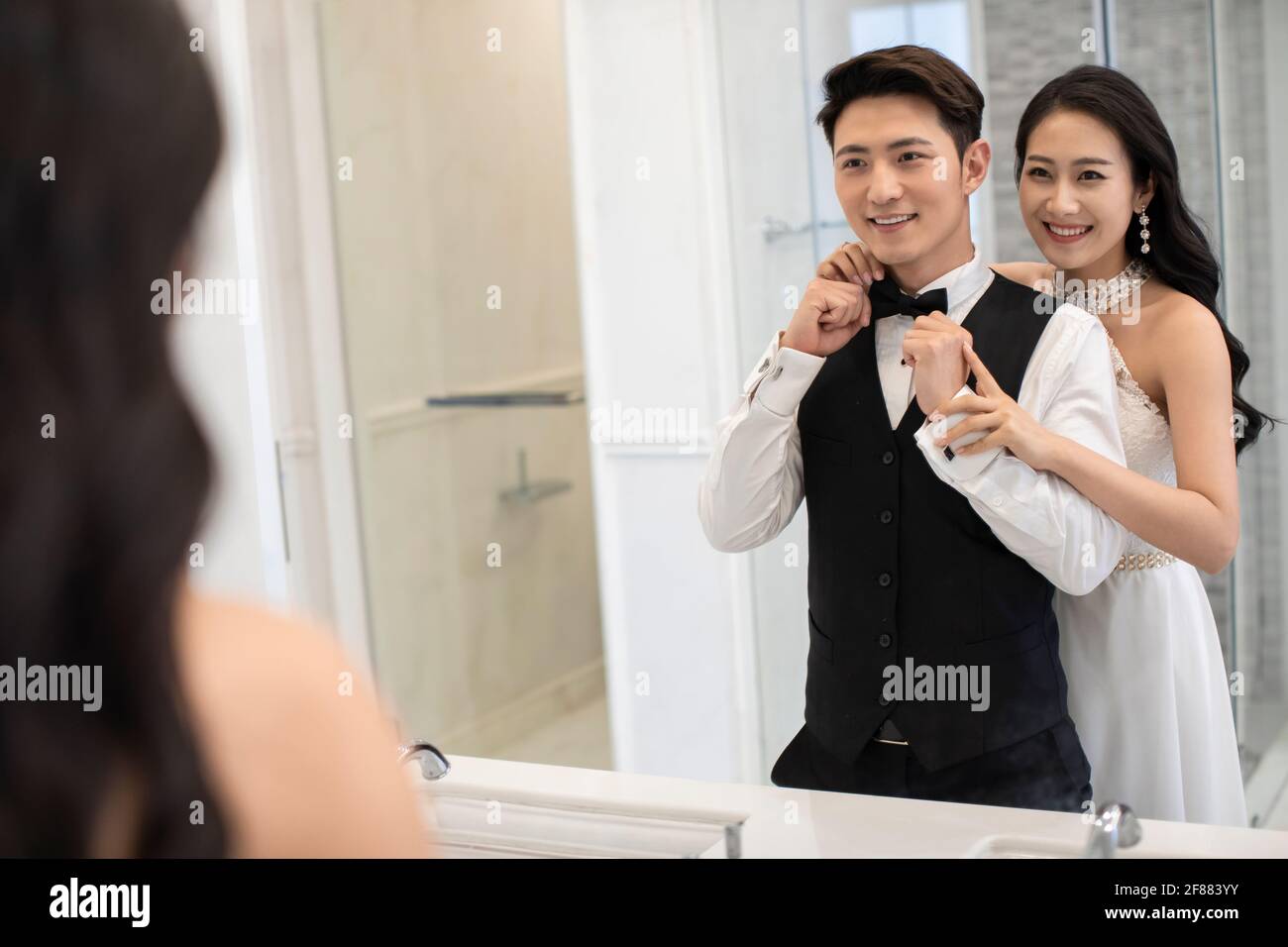 Loving young couple in bathroom Stock Photo - Alamy