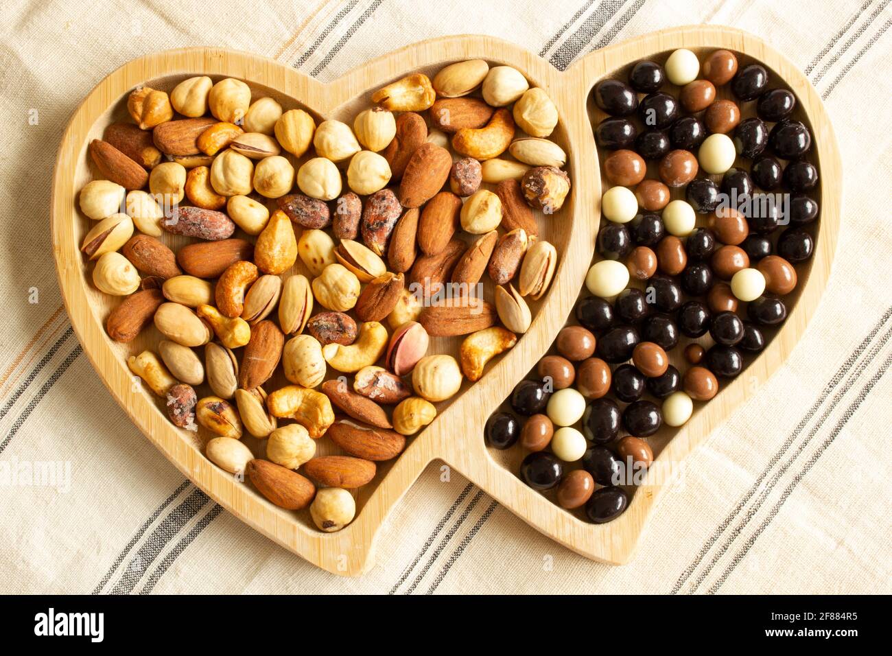 Mixed nuts and chocolate balls Stock Photo - Alamy