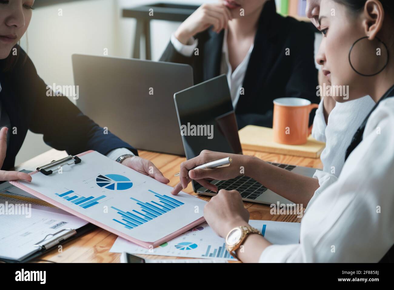 Group of people having business meeting discussion using laptop and ...