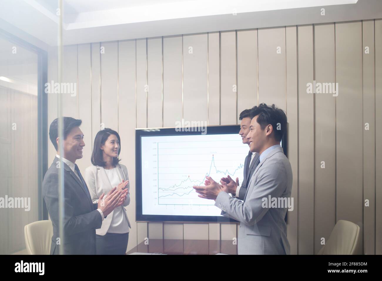 Business people clapping hands in conference room Stock Photo - Alamy