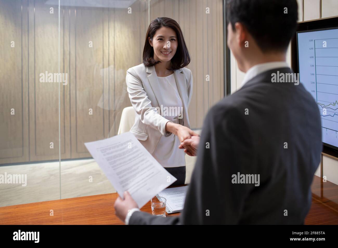 Interviewer and interviewee standing hi-res stock photography and ...