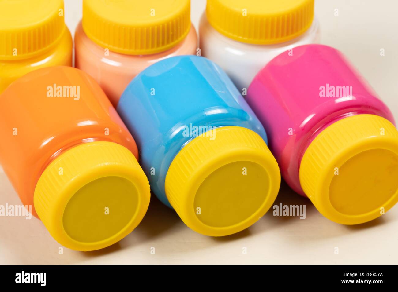 3 tubes of gouache paint lined up and lying down Stock Photo - Alamy