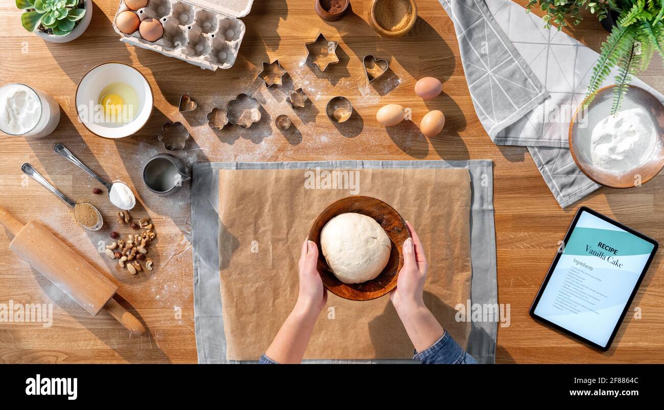 Top view of unrecognizable woman baking biscuits, desktop concept Stock ...