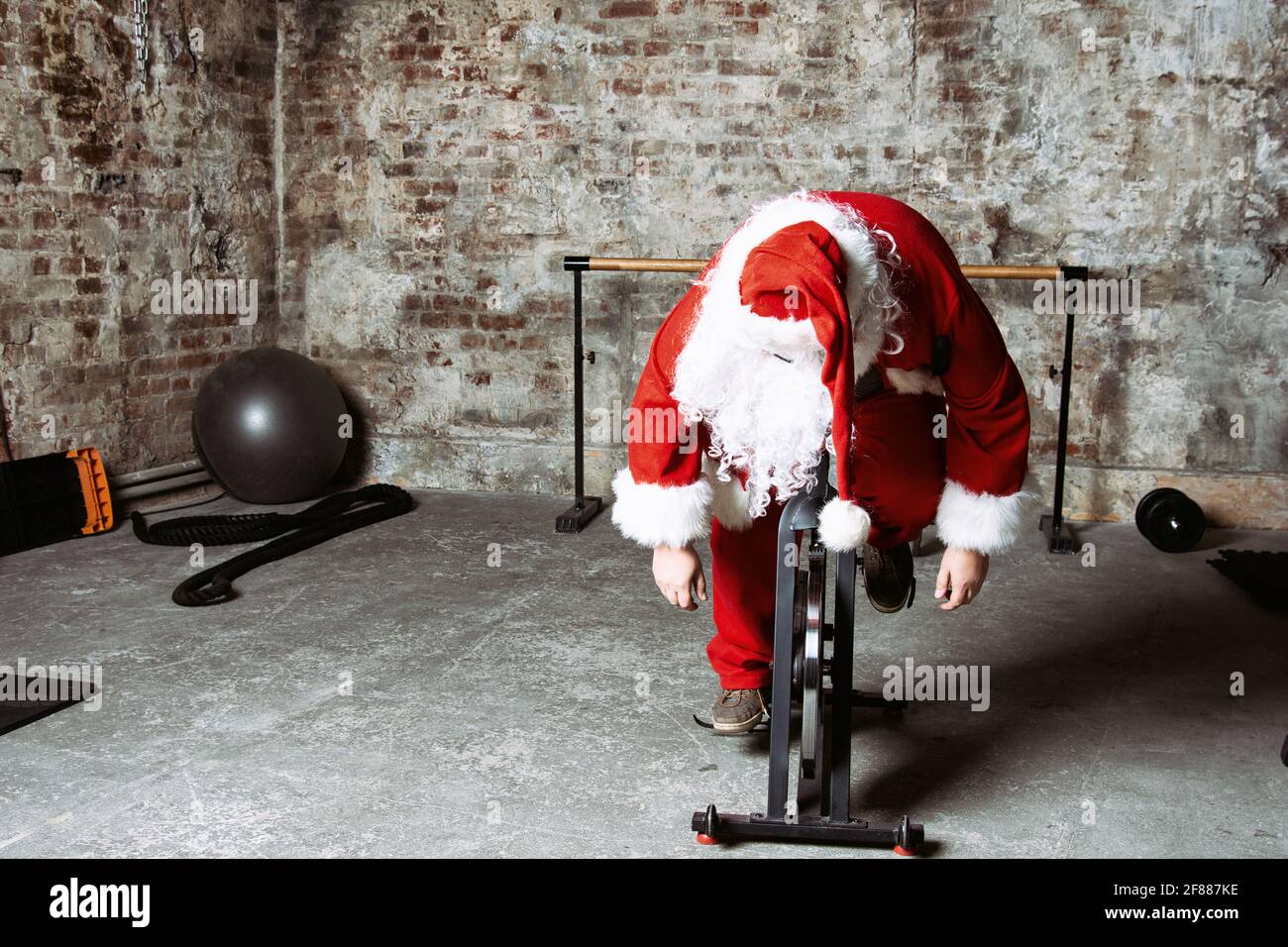 Fitness. Funny Santa Claus and gym Stock Photo - Alamy