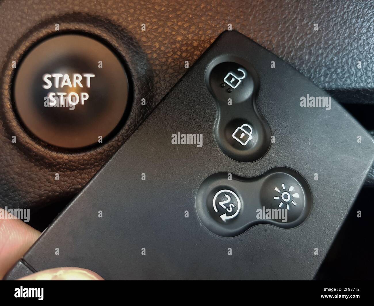 Start-stop button and car key card with hands-free function Stock Photo ...