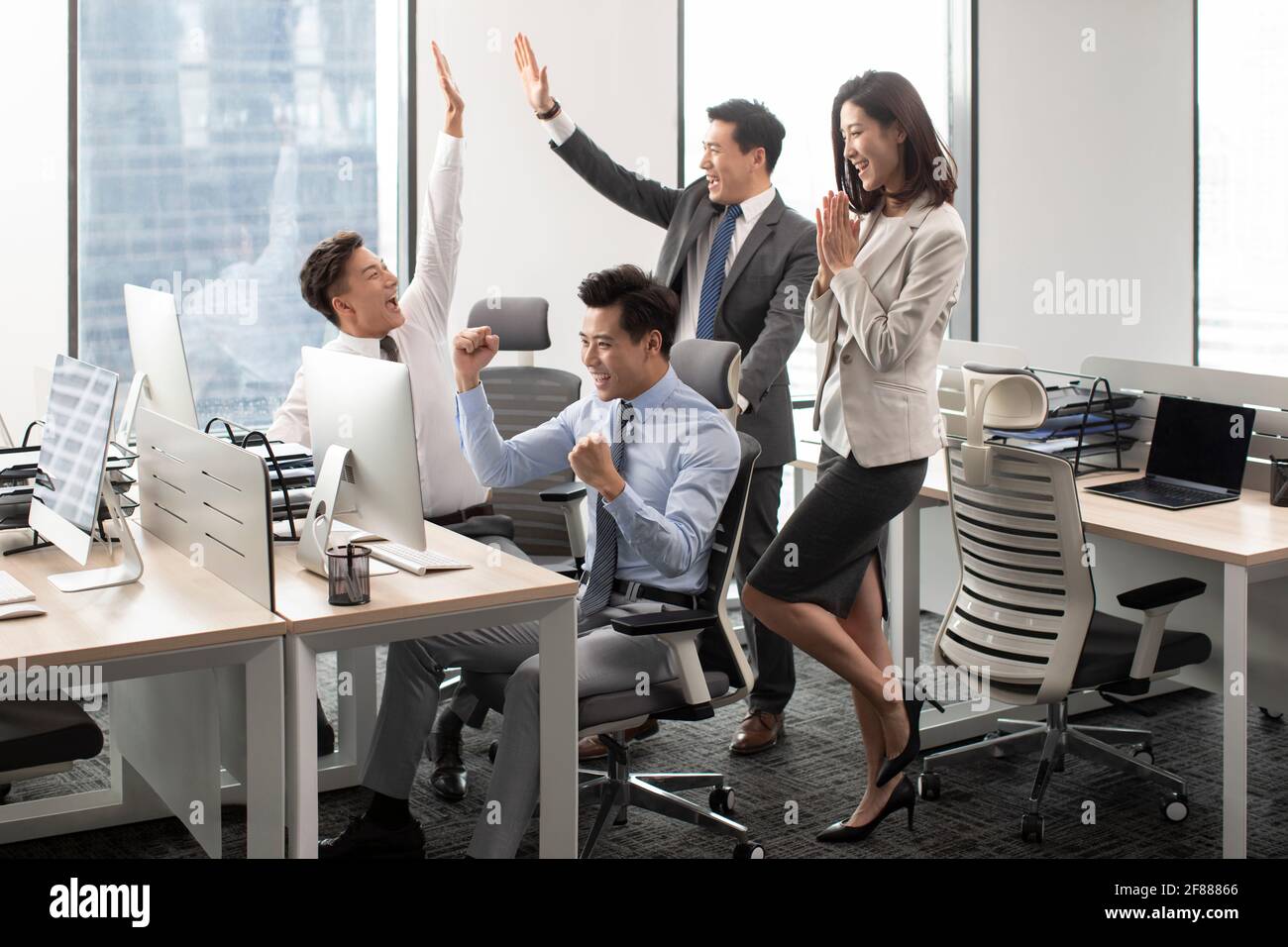 Business people celebrating in office Stock Photo - Alamy