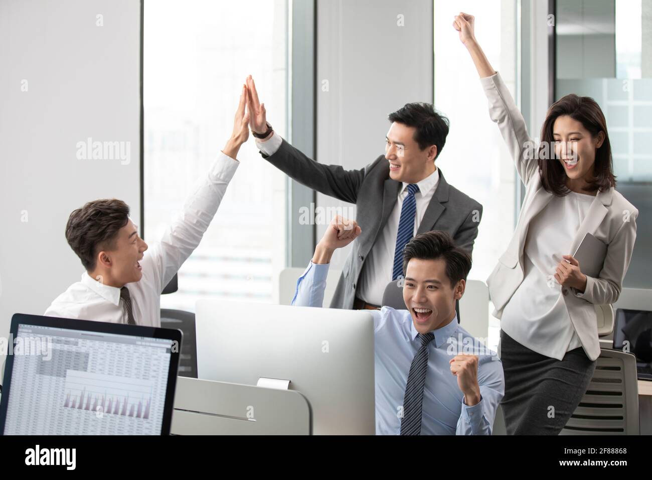 Business people celebrating in office Stock Photo - Alamy