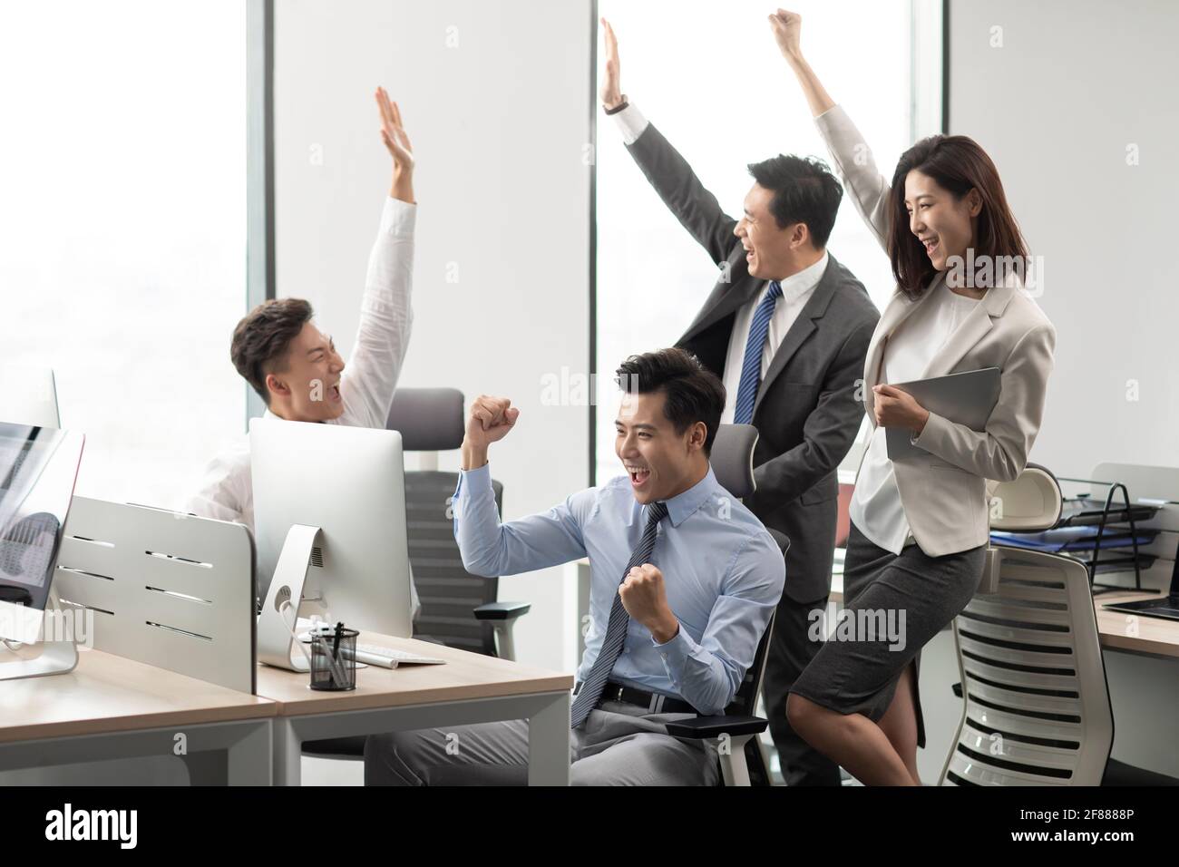 Business people celebrating in office Stock Photo - Alamy