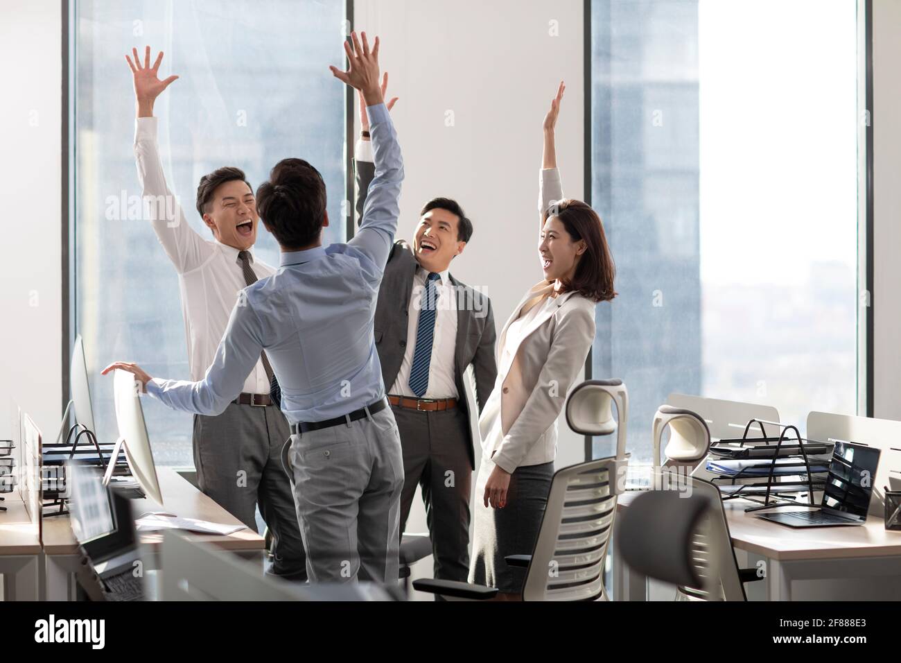 Business people celebrating in office Stock Photo - Alamy