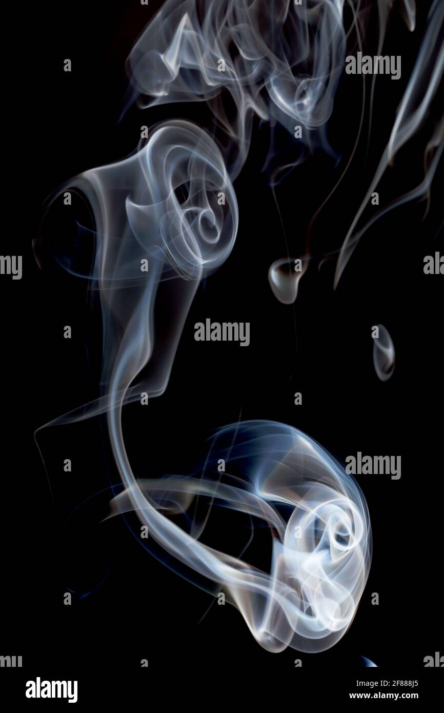 Cloud of smoke on black background Stock Photo - Alamy