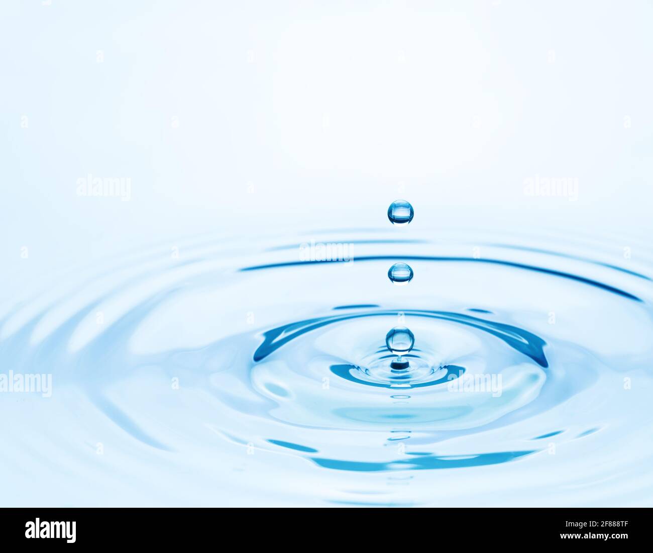 Fallen drop on the water surface. Nature and environment background ...