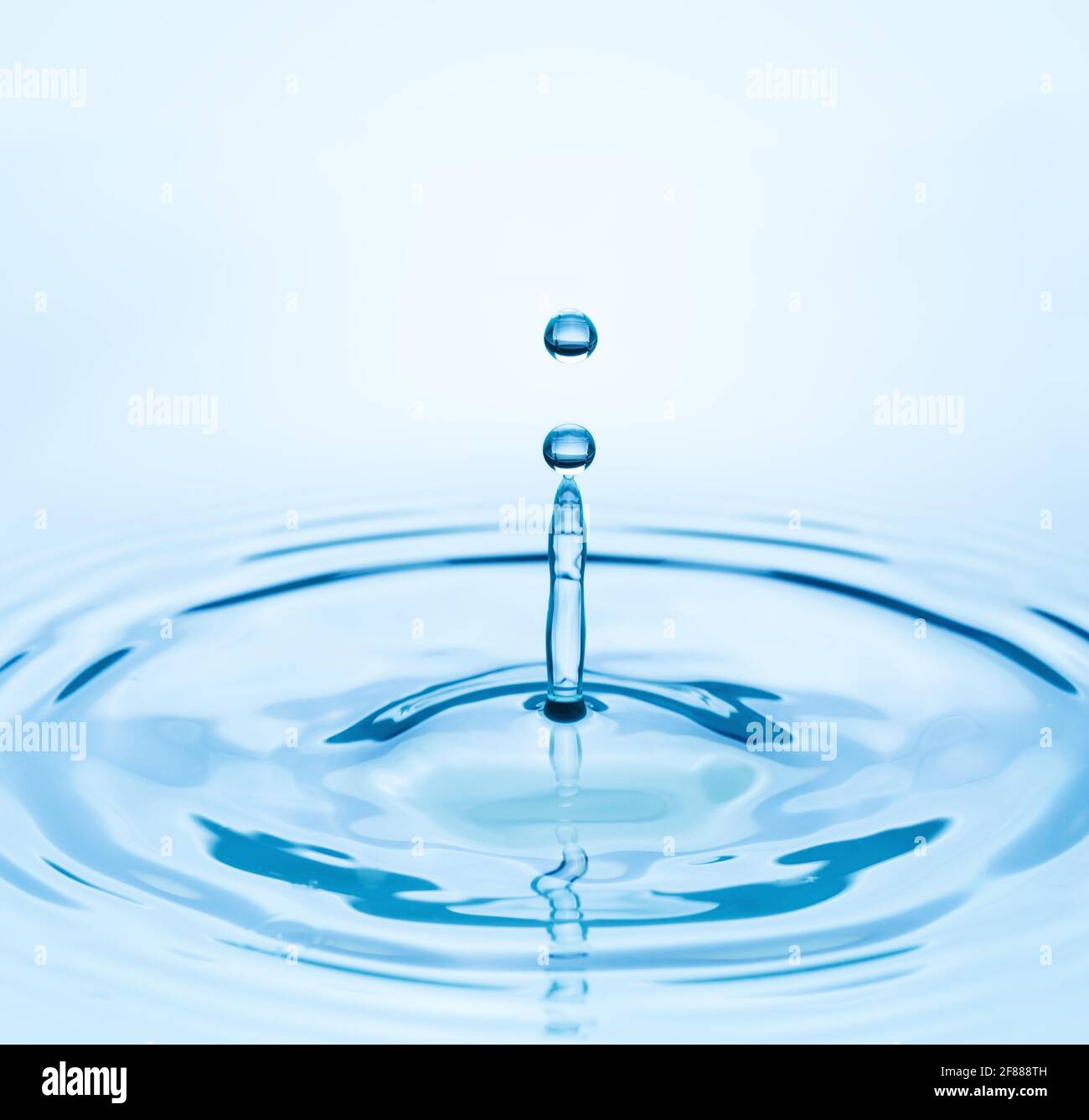 Fallen drop on the water surface. Nature and environment background ...