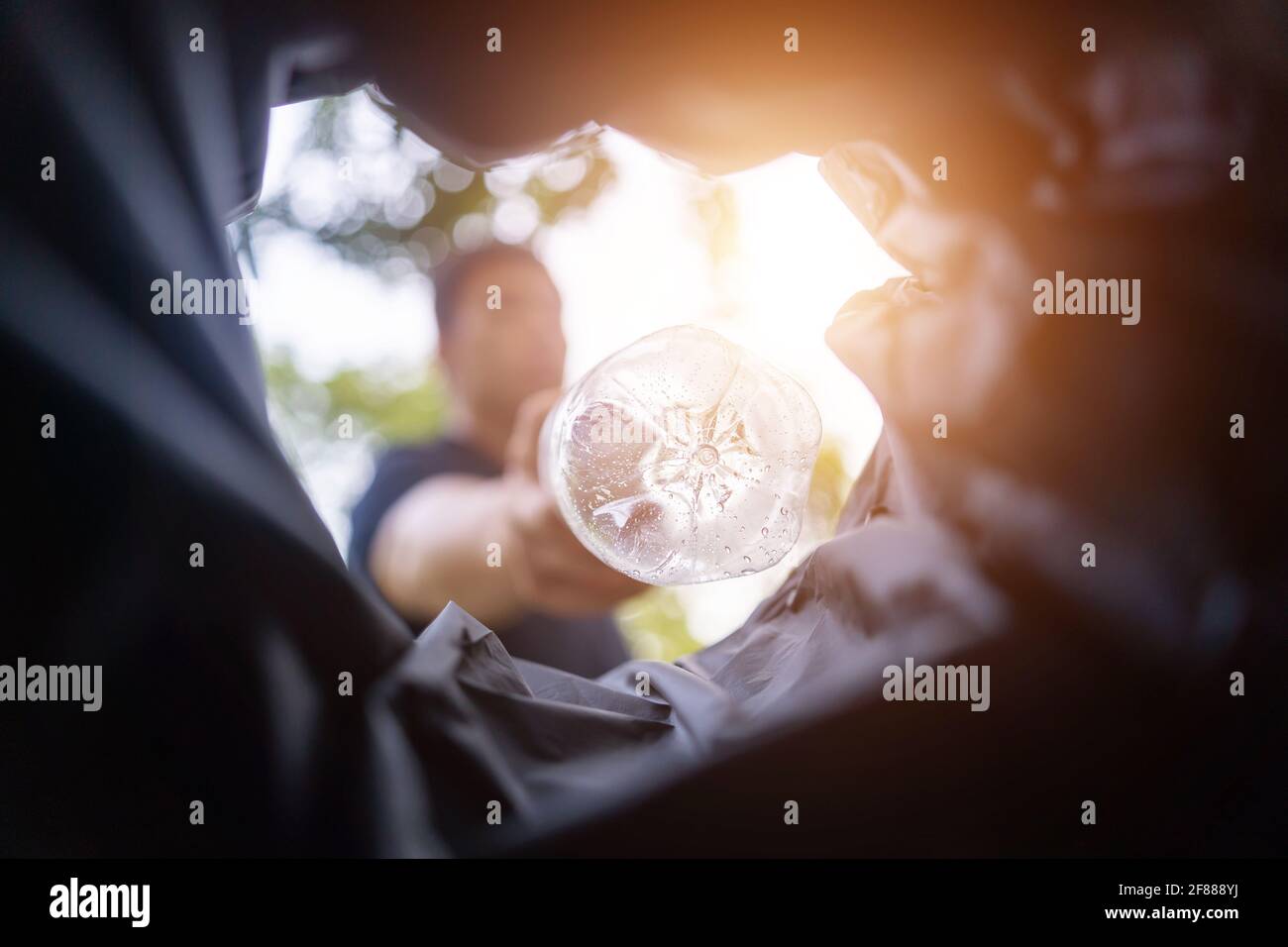 Man hold blue bin hi-res stock photography and images - Alamy
