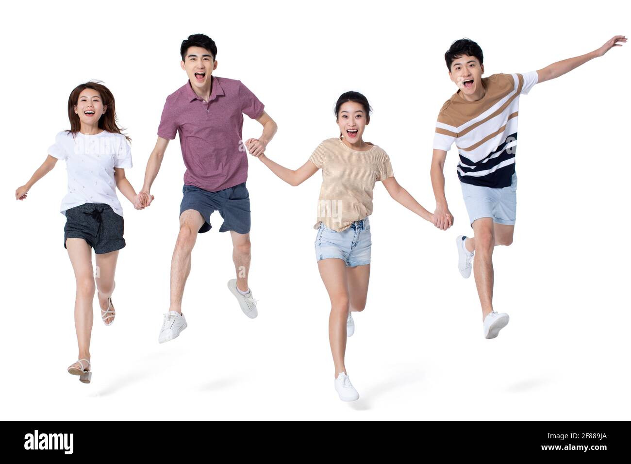 Four friends jumping mid air hi-res stock photography and images - Alamy