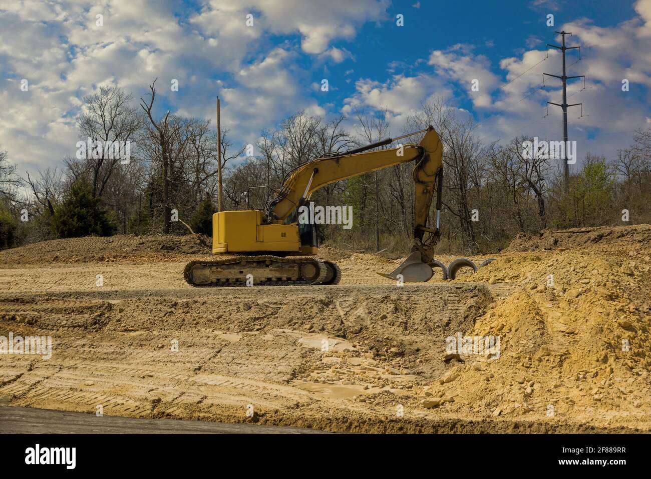 The excavators in working on the under construction site of a new road ...