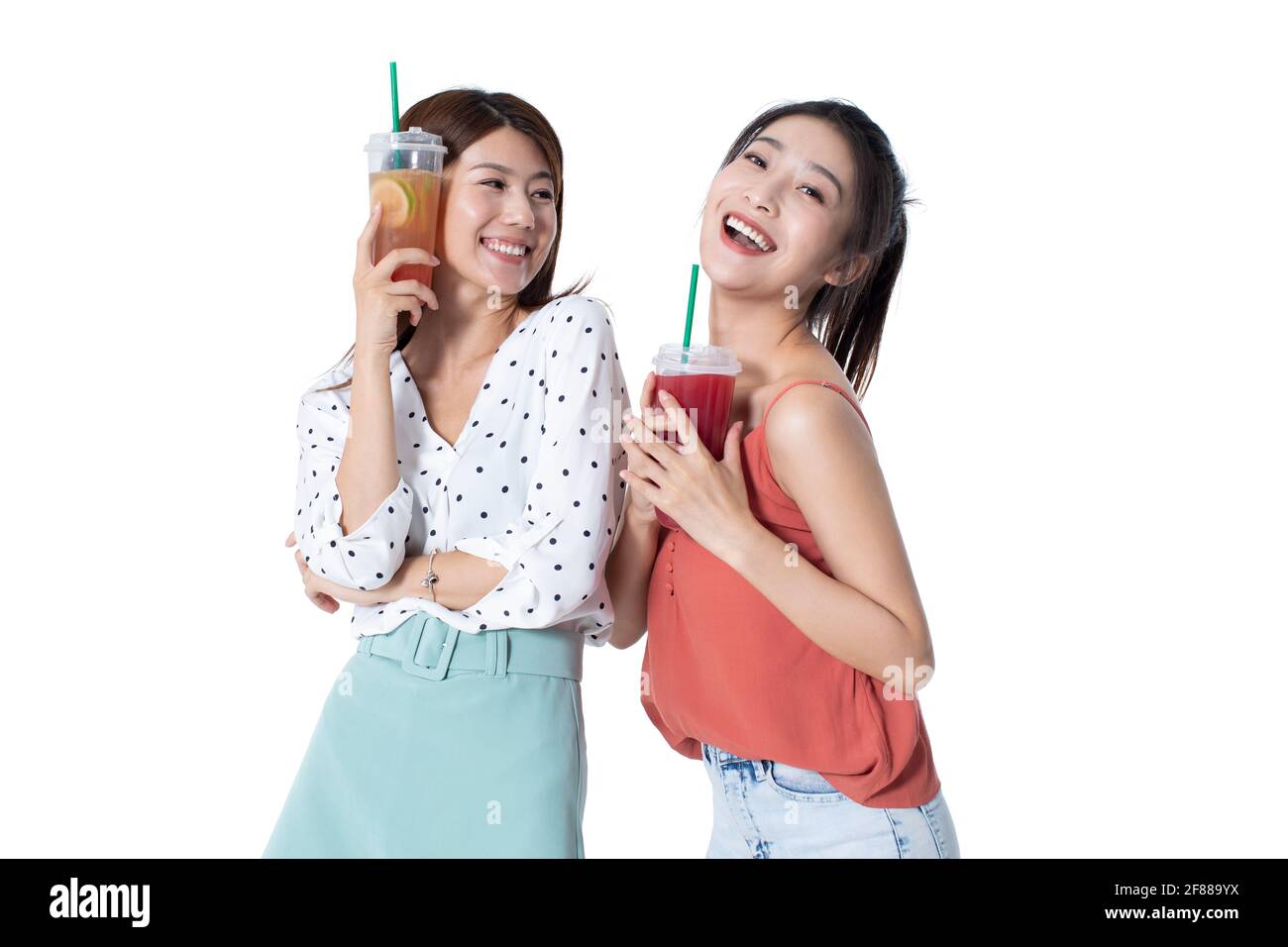 Cheerful young women drinking hi-res stock photography and images - Alamy